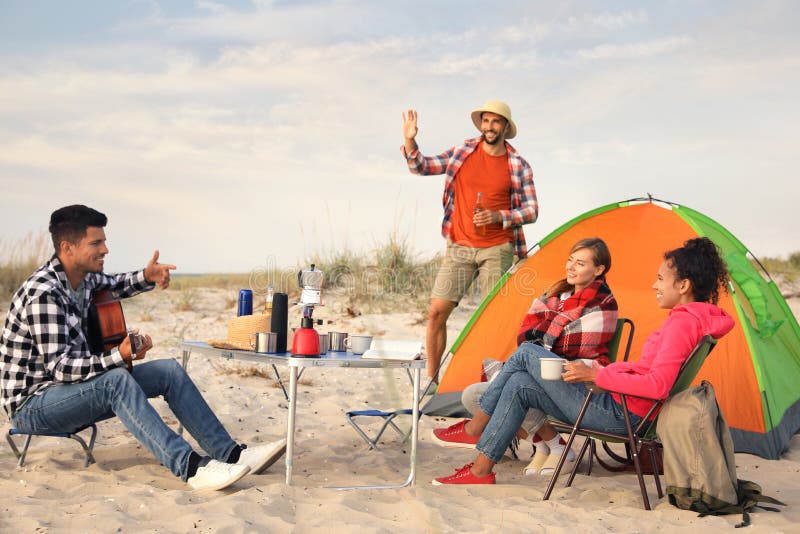Friends Resting on Sandy Beach. View from Camping Tent Stock Photo ...