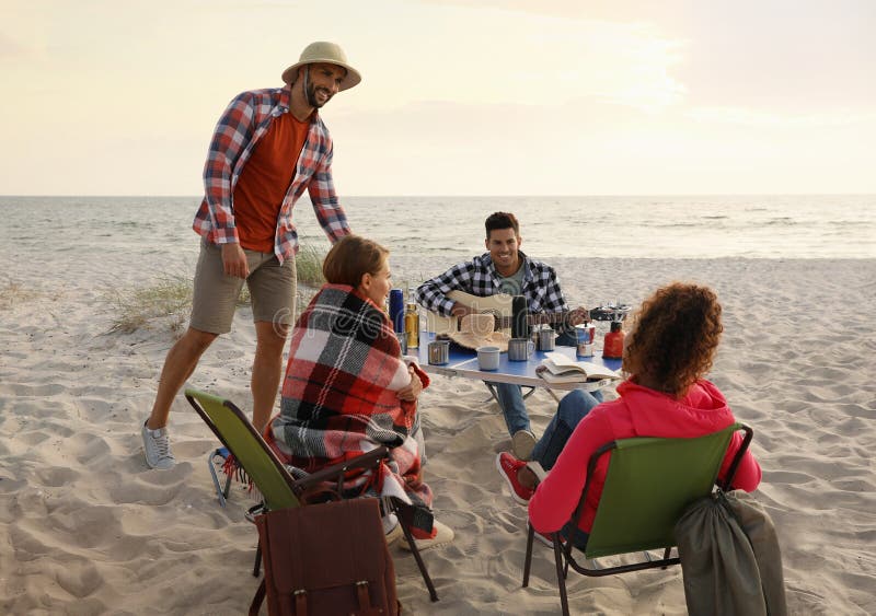 Friends Resting on Sandy Beach. View from Camping Tent Stock Photo ...