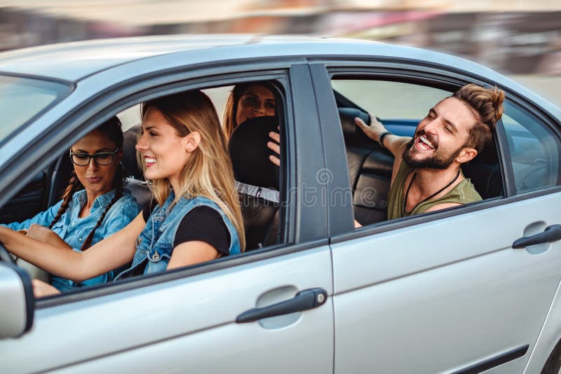 Friends Riding in the Car with Open Windows and Laughing Stock Image ...