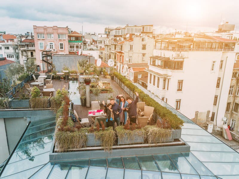 Friends on the Rooftop stock image. Image of architectural - 106189109