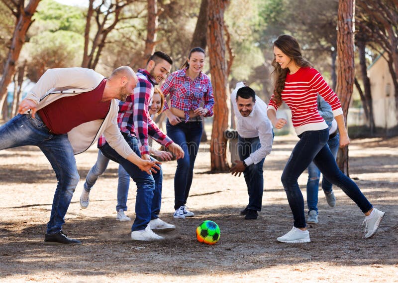 Friends running with ball stock image. Image of pals - 56511513