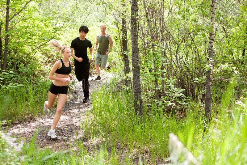 Friends Running in the Forest Stock Image - Image of exercise, fresh ...