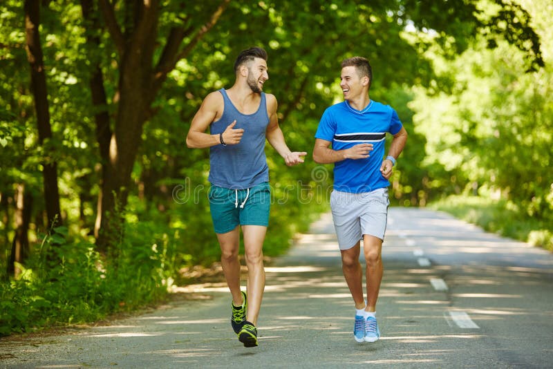 Friends Running through Forest Stock Image - Image of lifestyle, health ...