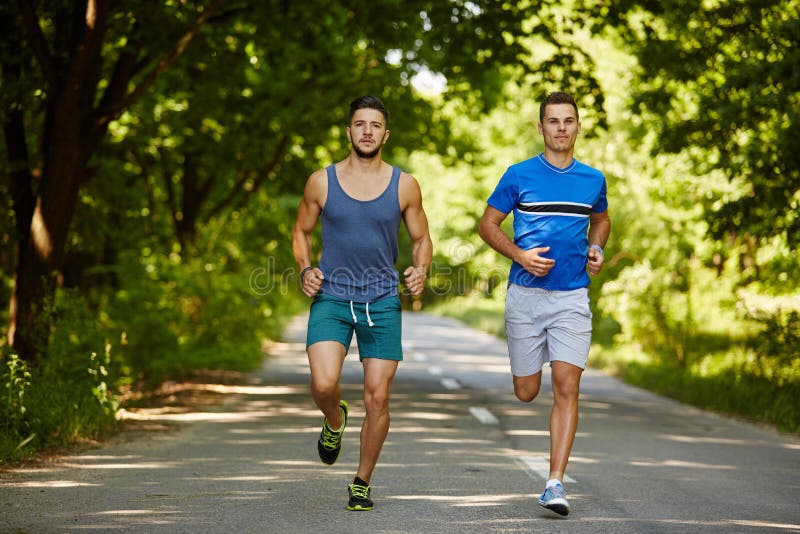 Friends Running through Forest Stock Image - Image of activity, friends ...