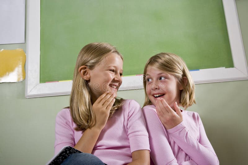 Friends in class talking stock image. Image of elementary - 15845881