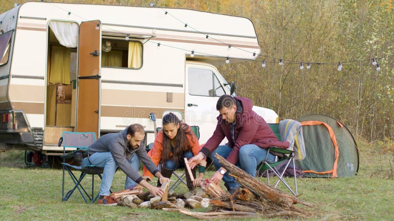 Friends Setting Up the Wood for Camp Fire Stock Image - Image of ...