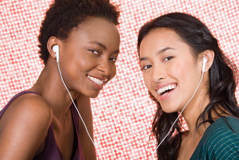 Friends sharing mp3 player stock image. Image of asian - 62561615