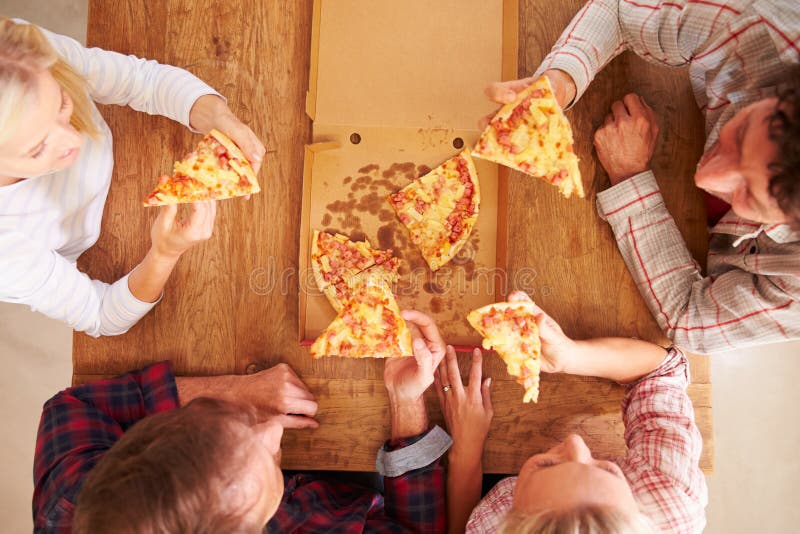 Friends Sharing a Pizza Together, Overhead View Stock Photo - Image of ...