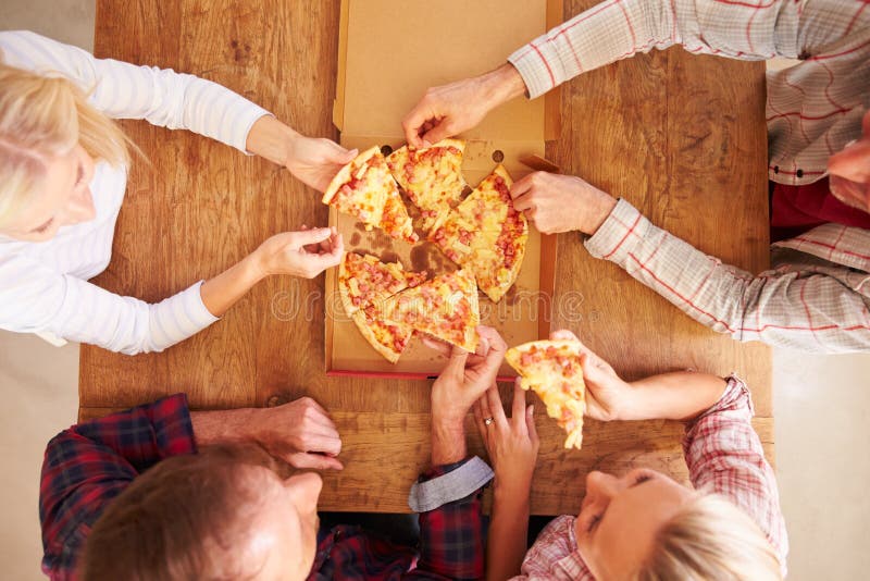 Friends Sharing a Pizza Together, Overhead View Stock Image - Image of ...