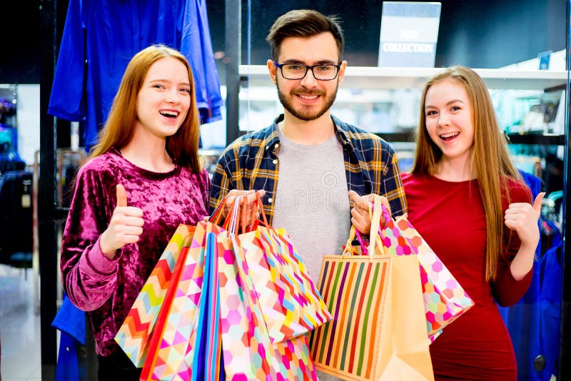 Friends shopping in mall stock photo. Image of happy - 94454466