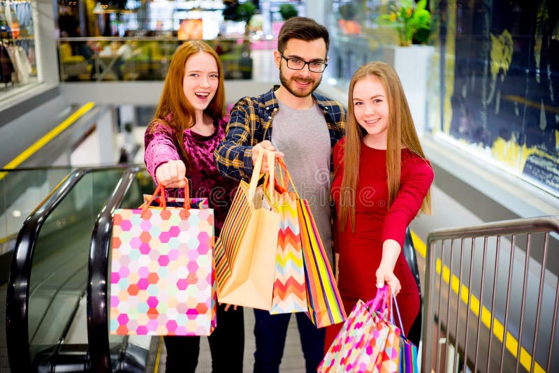 Friends shopping in mall stock image. Image of consumerism - 94873845