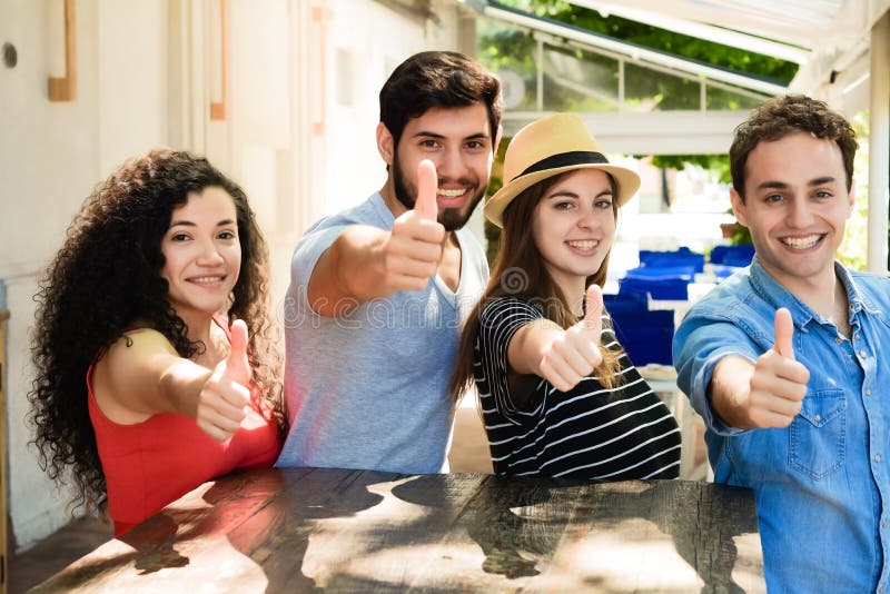 Friends showing thumbs up stock photo. Image of cheerful - 146526382