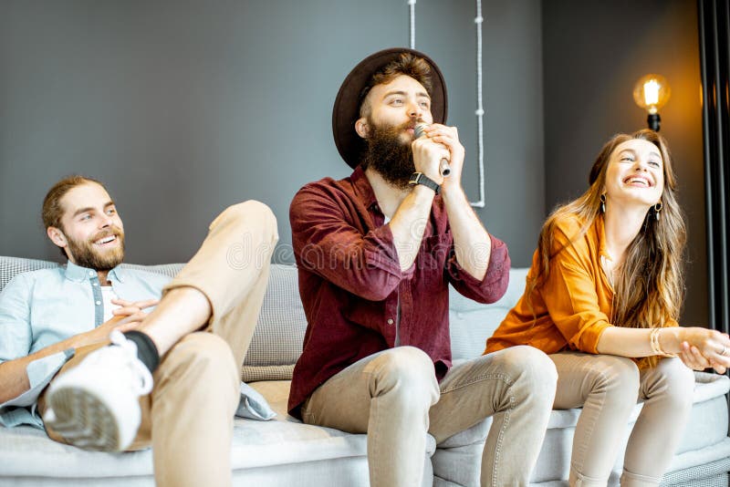 Friends singing at home stock photo. Image of singing - 150390862