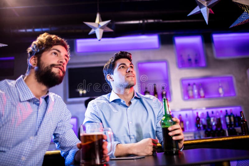 Friends Sitting at Bar Counter and Having Beer Stock Image - Image of ...
