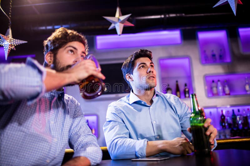 Friends Sitting at Bar Counter and Having Beer Stock Image - Image of ...