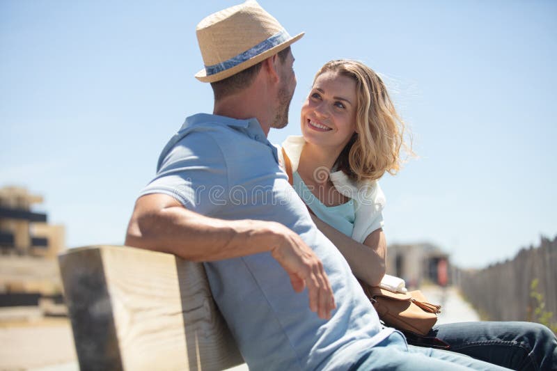 Friends Sitting on Bench Talking and Having Fun Stock Image - Image of ...