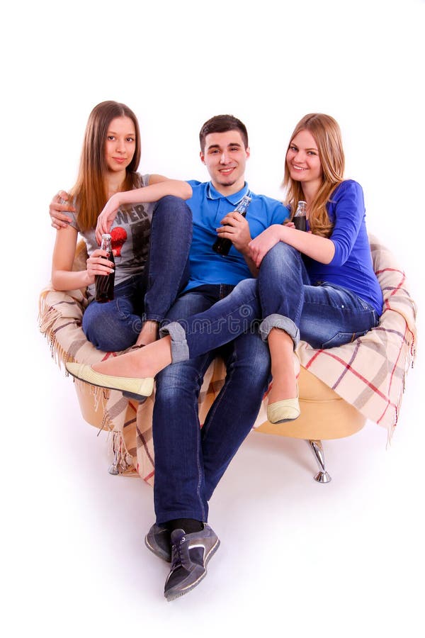 Friends Sitting on a Sofa and Drinking Coca Cola Stock Photo - Image of ...