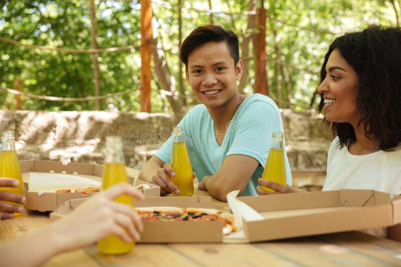 Friends Sitting by the Table in Forest with Drinks Stock Photo - Image ...