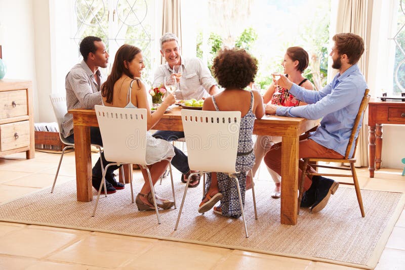 Friends Sitting at a Table Talking during a Dinner Party Stock Image ...