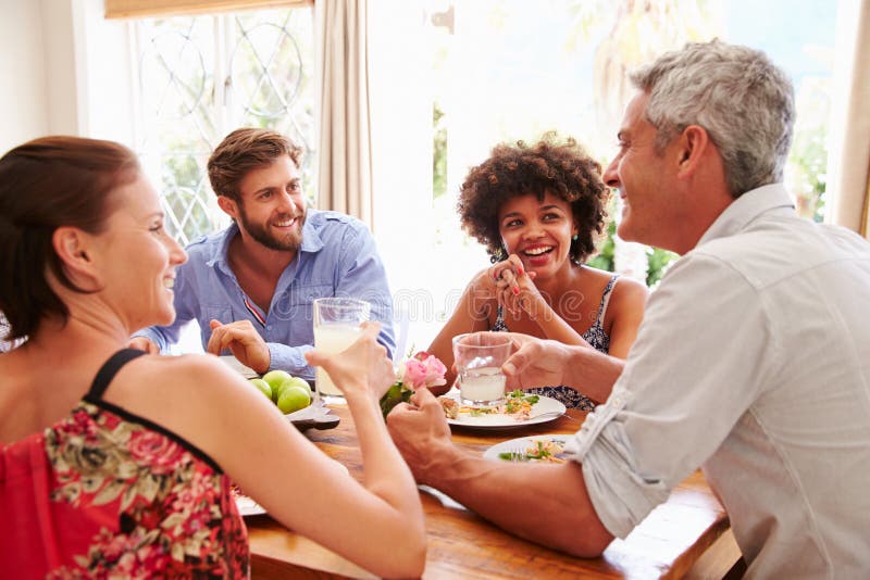 Friends Sitting at a Table Talking during a Dinner Party Stock Photo ...