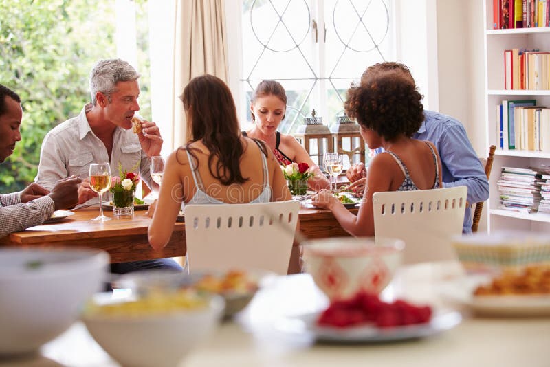 Family Eating Dinner at a Dining Table Stock Photo - Image of parents ...