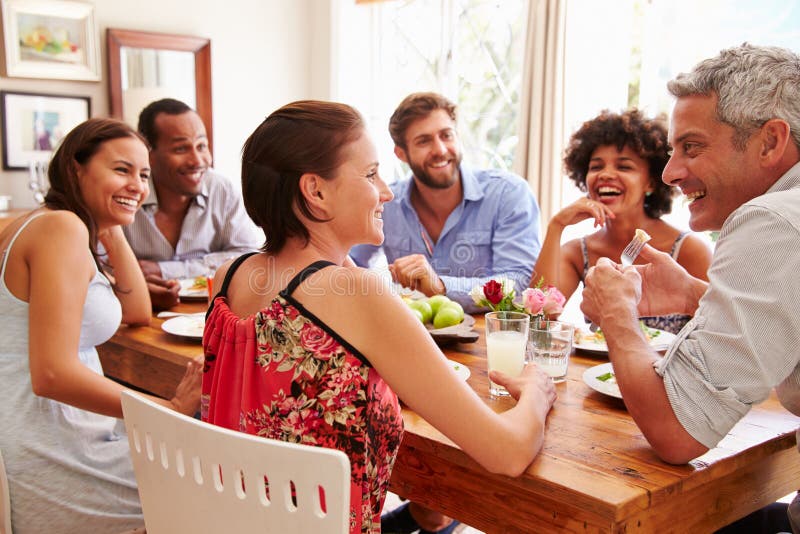 Friends Sitting at a Table Talking during a Dinner Party Stock Image ...