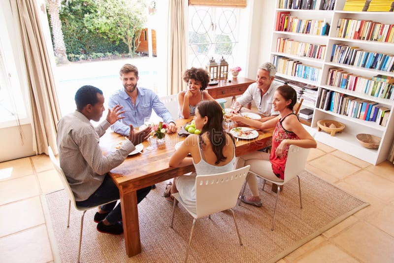 Friends Sitting at a Table Talking during a Dinner Party Stock Image ...
