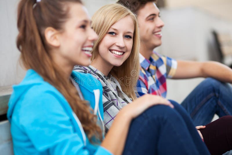 Three friends stock photo. Image of outdoors, sitting - 20954146