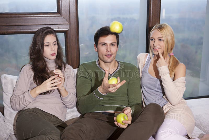 Friends Sitting Together on the Sofa Having Fun Stock Photo - Image of ...