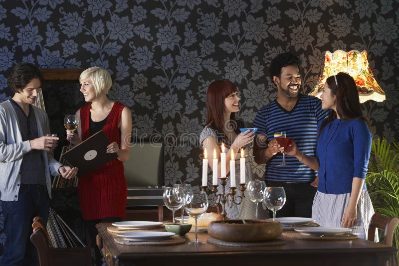 Friends Smiling by Dining Table Stock Image - Image of listening ...