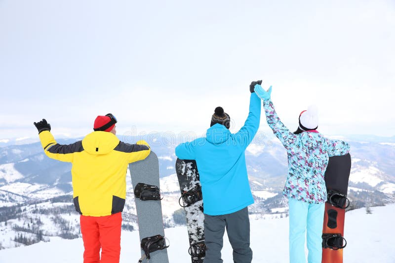 Friends with Snowboards at Mountain Resort. Winter Vacation Stock Image ...