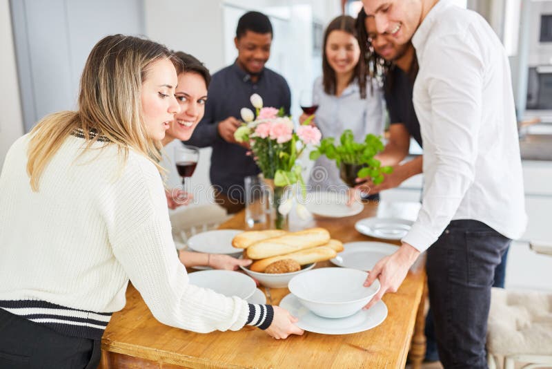 Friends in Student Shared Flat Set Dining Table for Meal Stock Photo ...