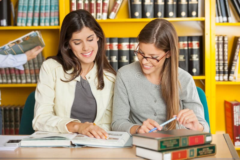 Friends Studying at Table in Library Stock Image - Image of indoor ...