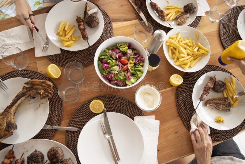 Friends at Summer Dinner Table Eating Together and Having Fun Stock ...