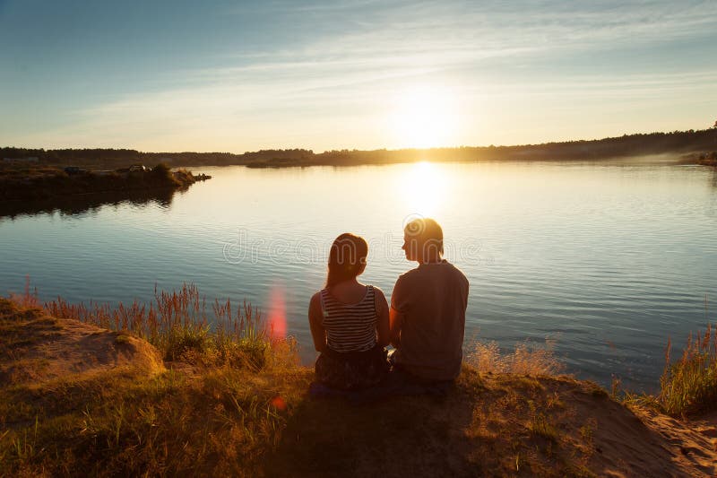 Friends at sunset stock image. Image of night, dawn, romance - 58116355