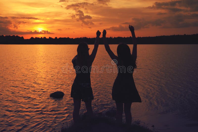 Friends at sunset stock photo. Image of happiness, beach - 45075912