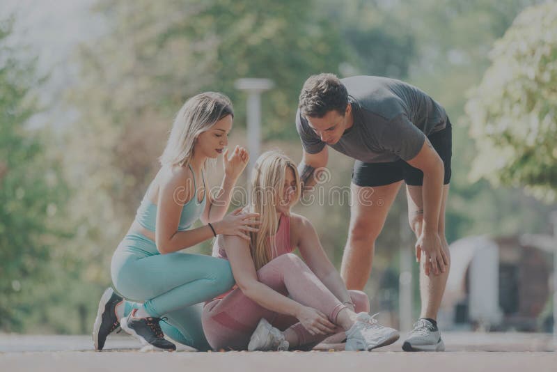 Friends Supporting Each Other during Outdoor Exercise in the Park Stock ...