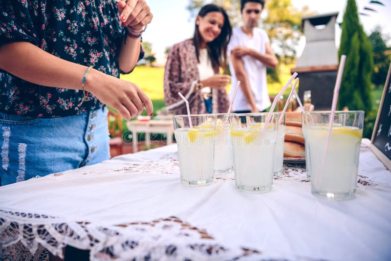 Friends at Table with Fresh Lemonade Having Fun Stock Photo - Image of ...