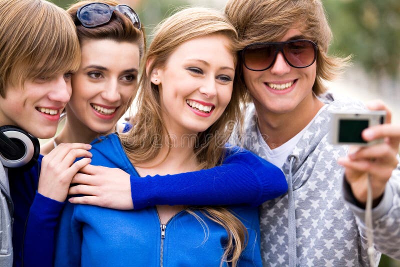 Two Friends Taking Pictures Stock Photo - Image of grass, outdoors ...