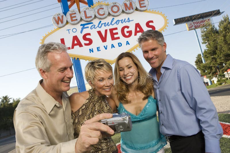 Friends Taking Self Portrait with Digital Camera at Park Stock Photo ...