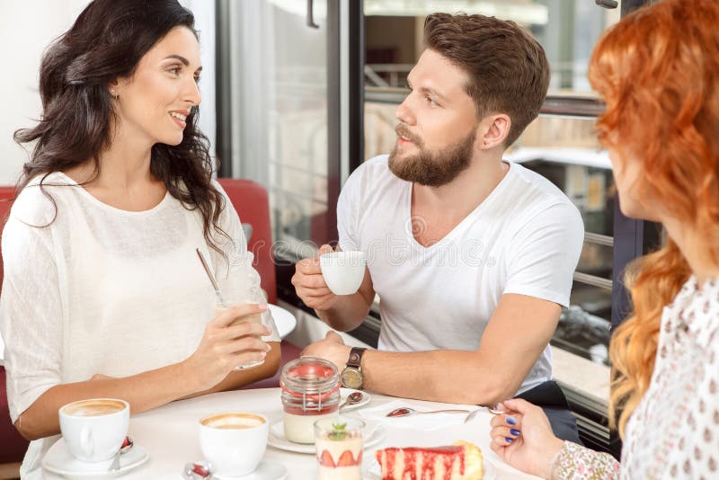Friends talking in a cafe stock image. Image of friendship - 61020985