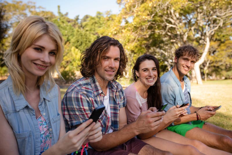 Friends Text Messaging on Mobile Phone Stock Image - Image of holiday ...