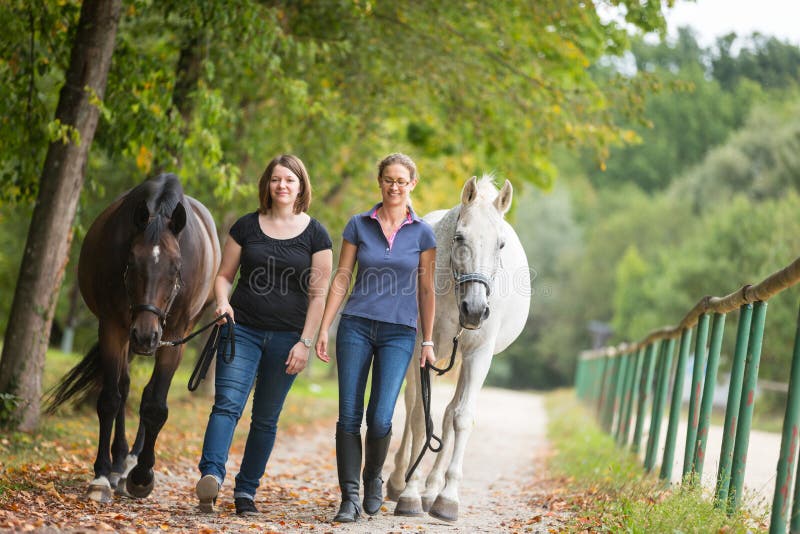 Friends with Their Horses stock image. Image of face - 133668979