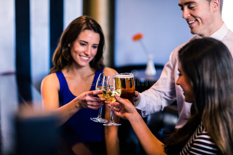 Friends toasting together stock image. Image of friend - 66144423