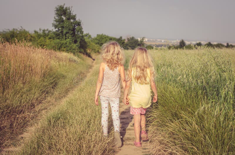 Friends stock photo. Image of outside, sunset, grass - 88937082
