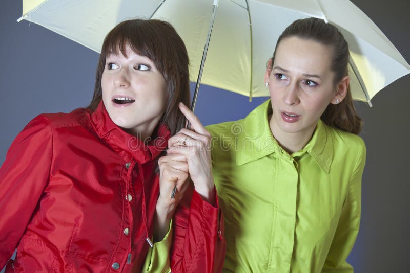 Friends under umbrella stock image. Image of weather - 12954311