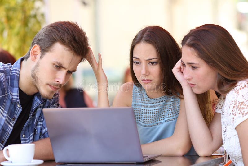 Friends Using a Laptop with Problems Stock Photo - Image of adults ...
