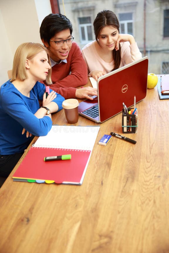 Friends Using Laptop Together Stock Photo - Image of casual, group ...