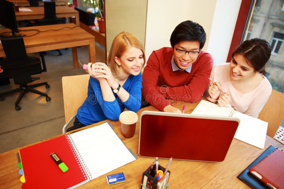 Friends Using Laptop Together Stock Photo - Image of laptop ...