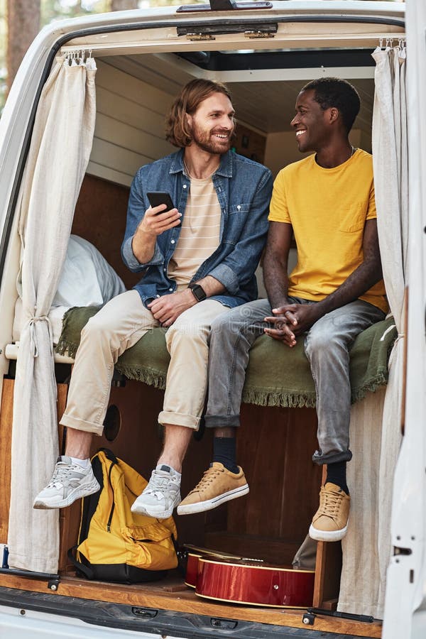 Friends Using Mobile Phone in Motorhome Stock Photo - Image of house ...